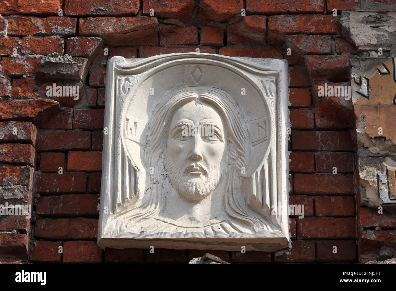 Icon of Jesus on wall of brick chapel, Krasnogorsk, Russia Stock Photo ...