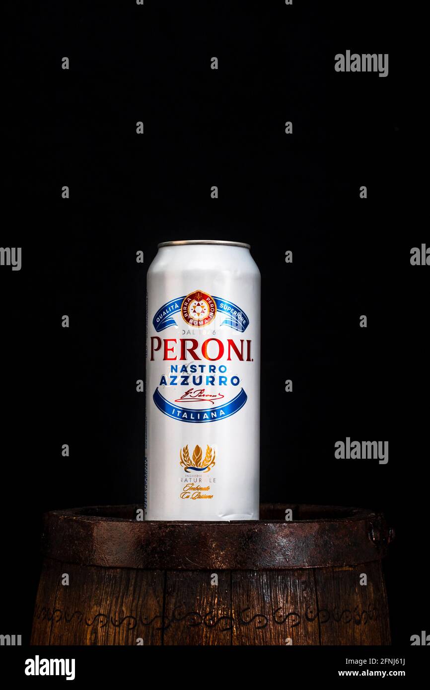 Can of Peroni beer on beer barrel with dark background. Illustrative ...