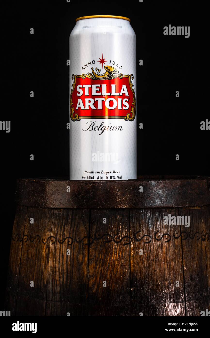 Can of Stella Artois beer on beer barrel with dark background ...