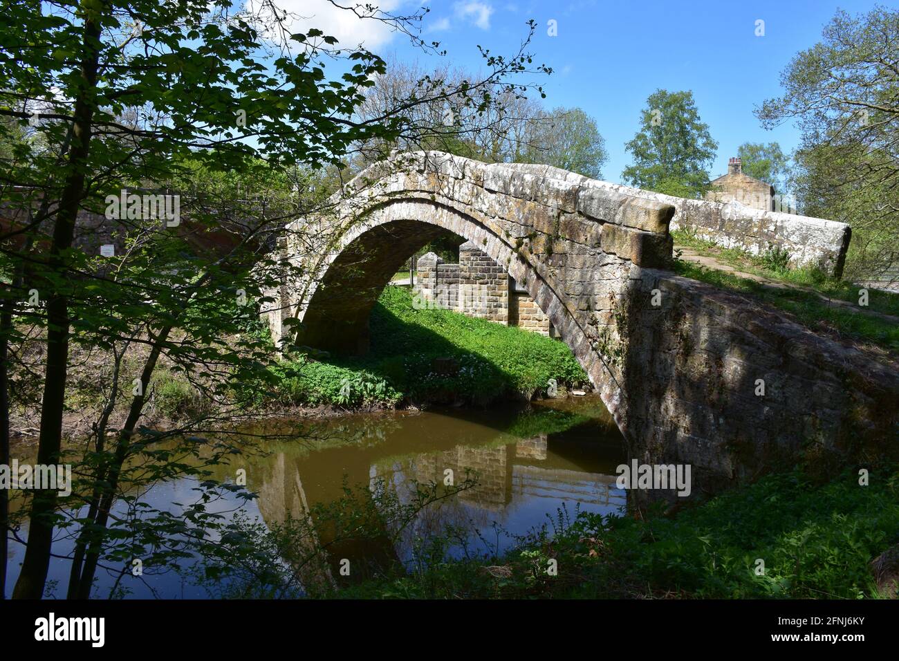 Arch stone foot path bridge over the river esk in Glaisdale Stock Photo ...