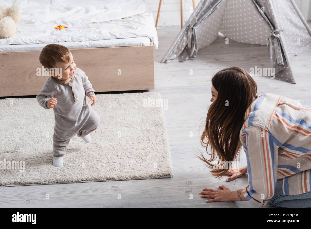 Parent encouraging child hi-res stock photography and images - Alamy