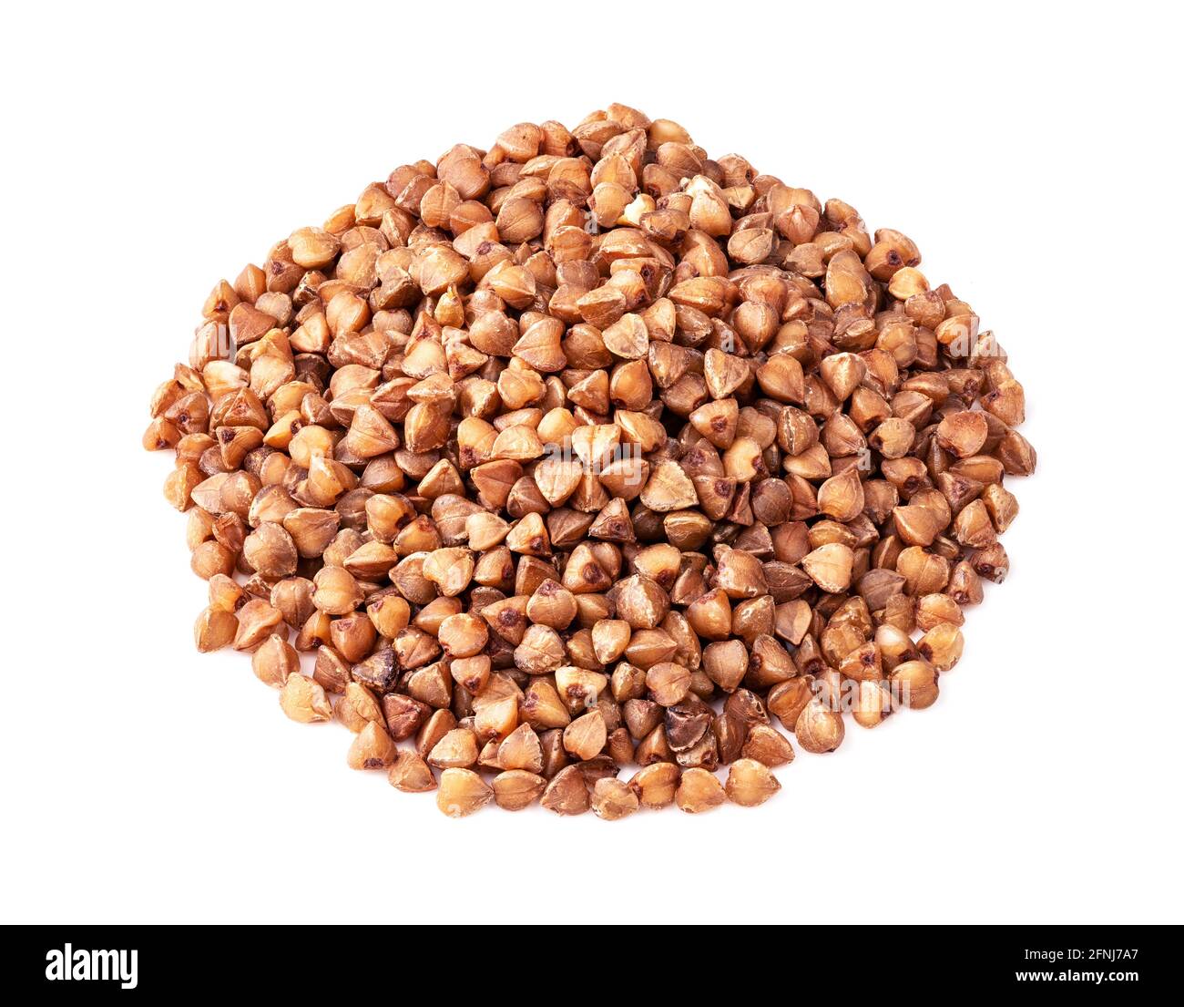 pile of roasted buckwheat grains closeup on white background Stock ...