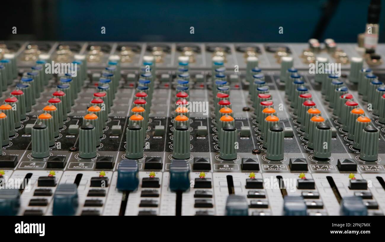 Sound mixer with continuous colored adjustment buttons and loudspeaker ...