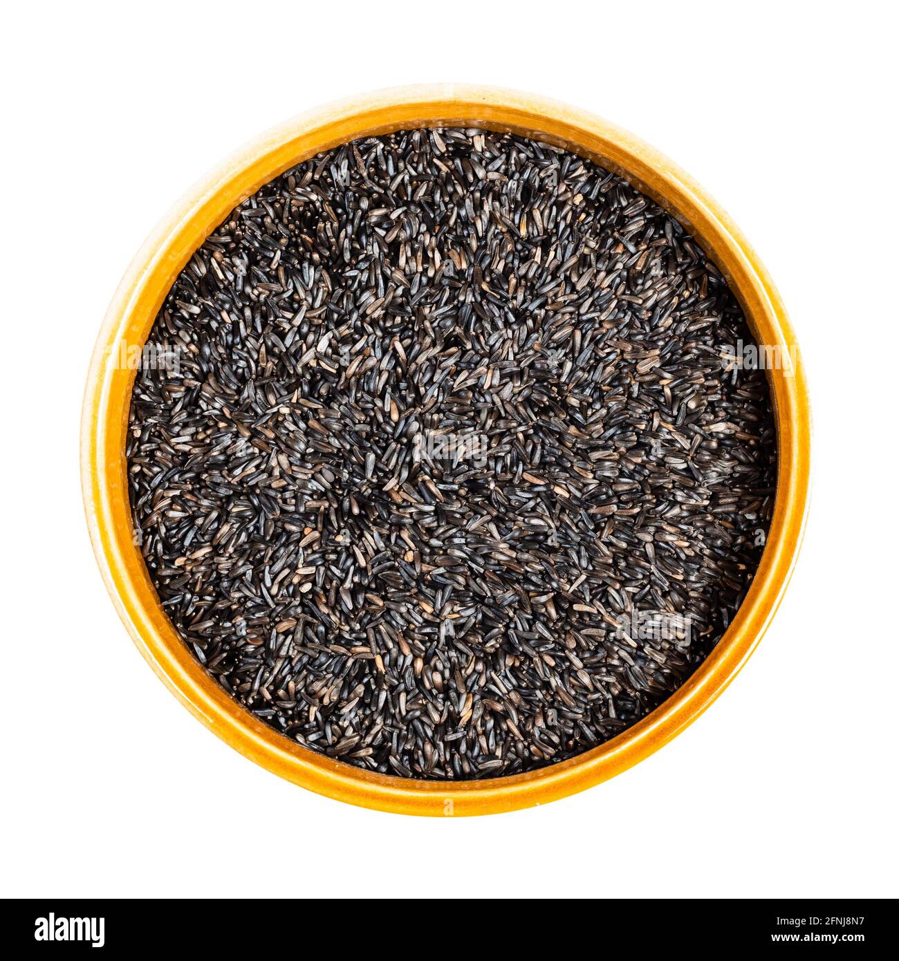 top view of niger seeds (Guizotia Abyssinica) in round ceramic bowl ...