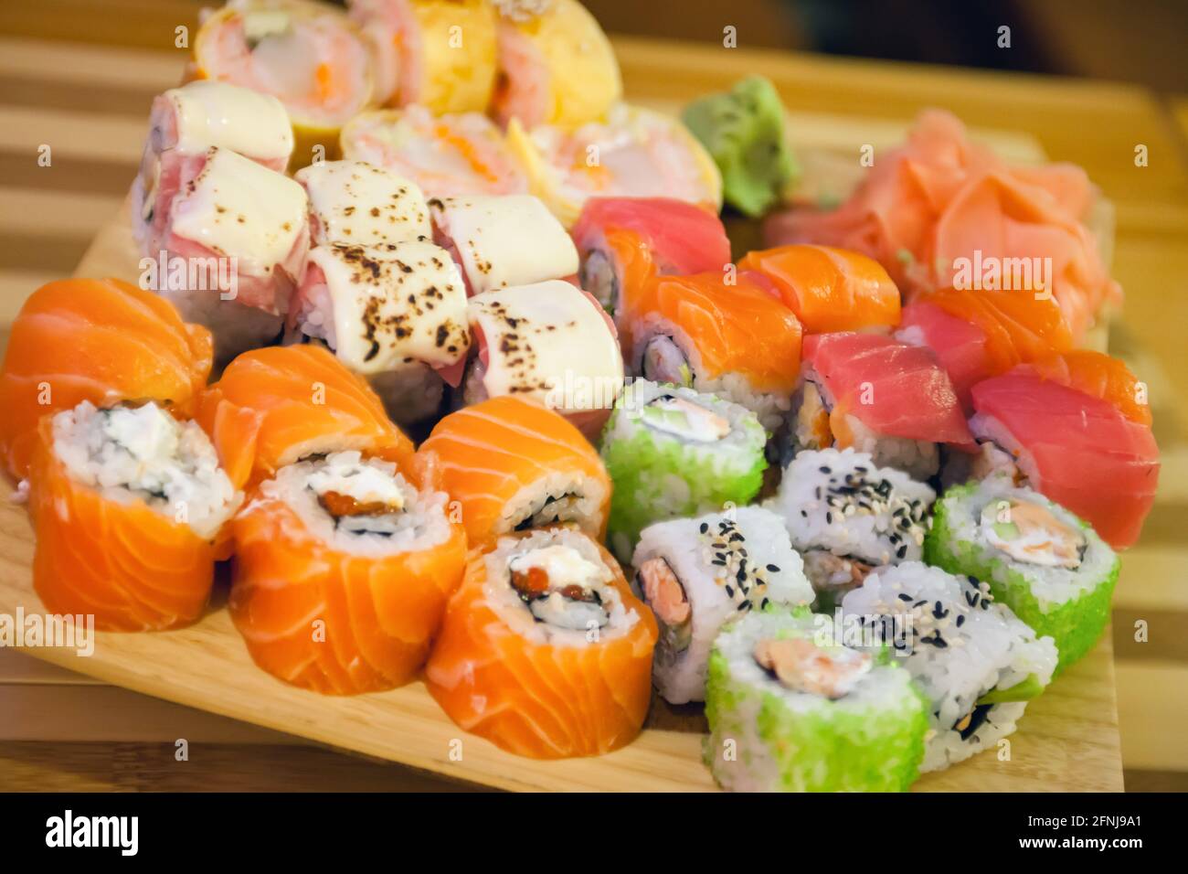 Assorted rolls are laid out on the board Stock Photo - Alamy