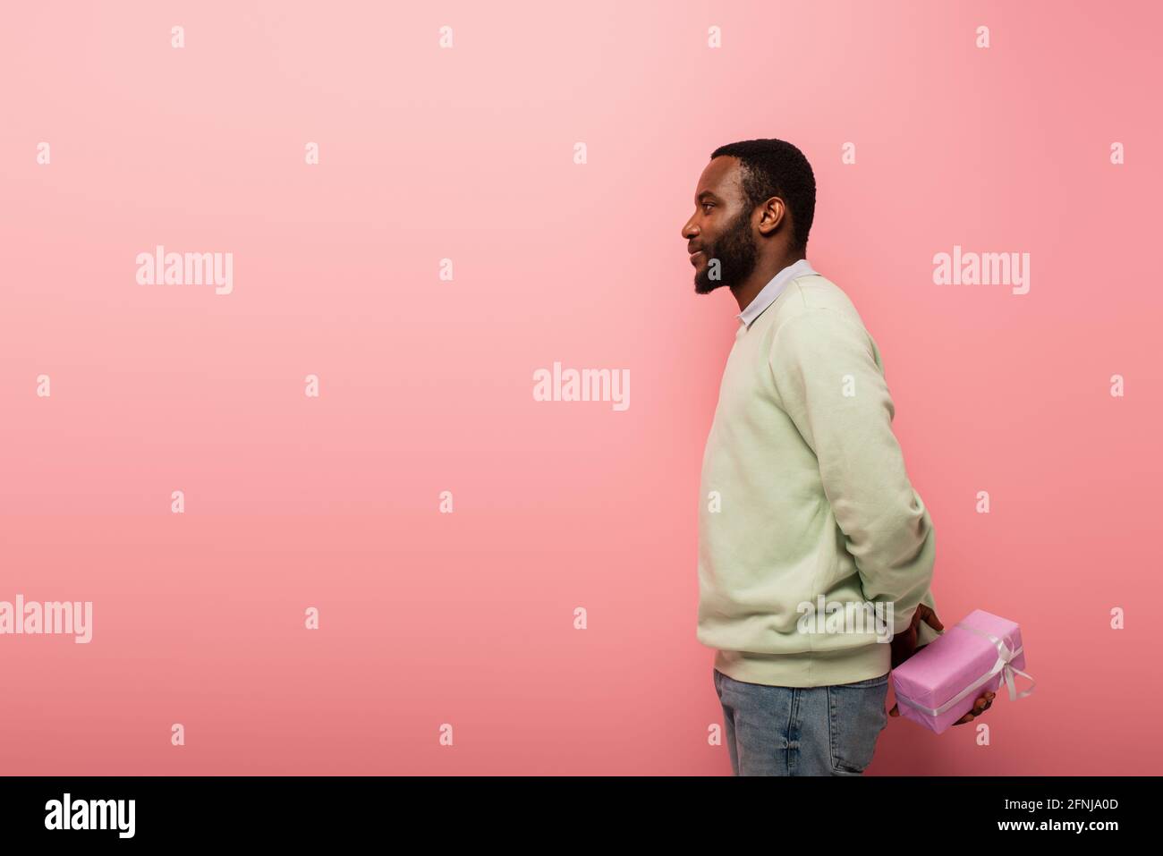 Man hands behind back side view hi-res stock photography and images - Alamy