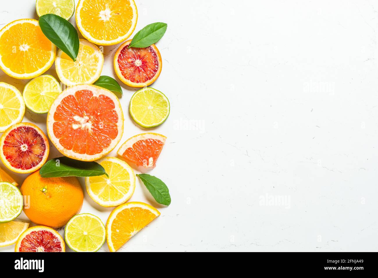Citrus fruits at white background Stock Photo - Alamy