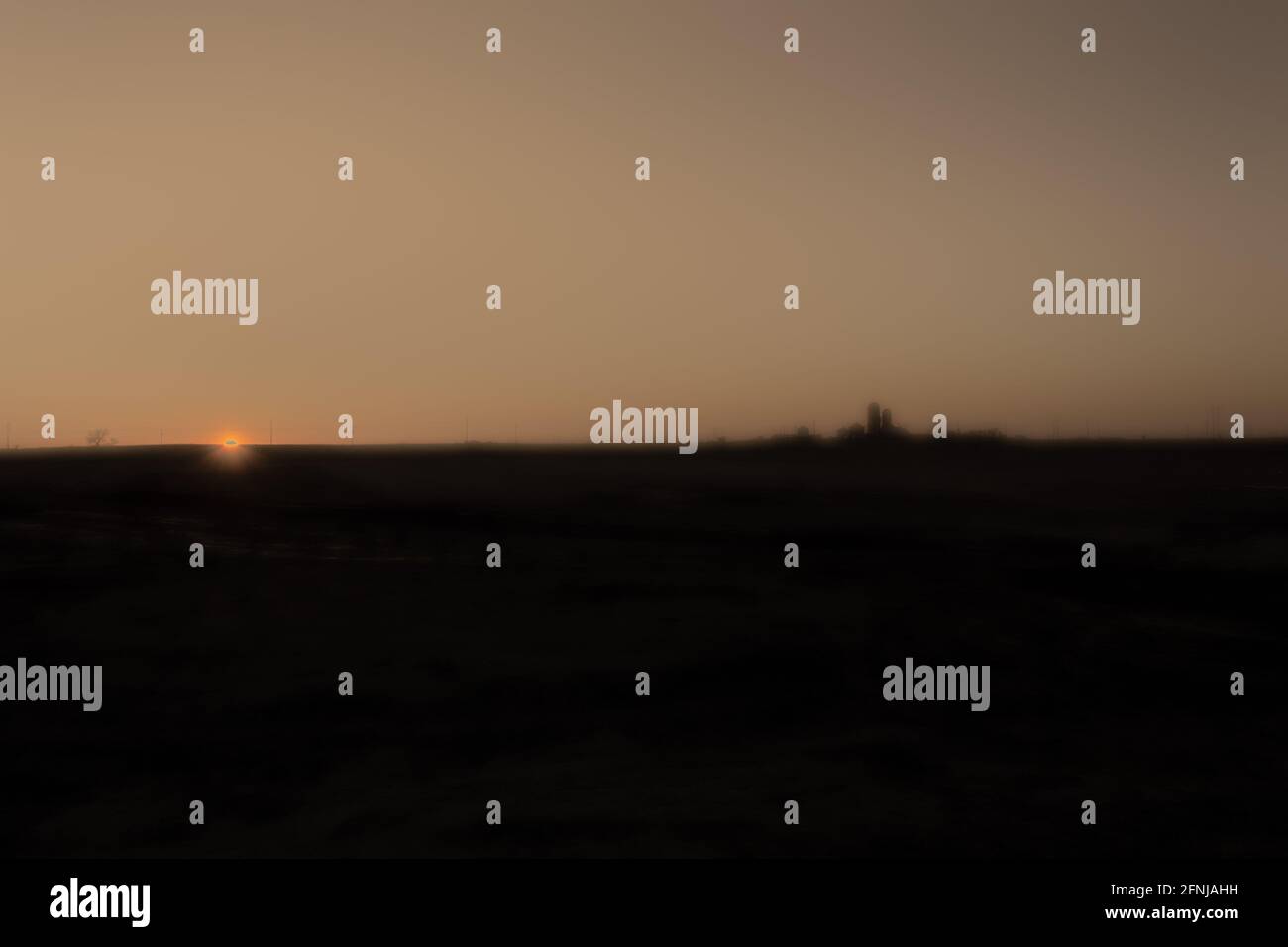 Abstract reworking of a rural sunset image for use as a background or ...