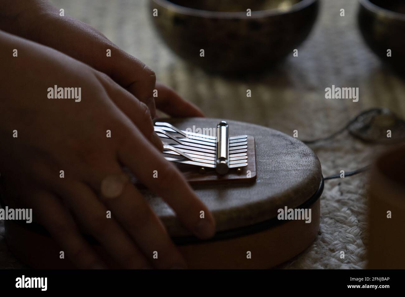 Tibet practice for sound therapy: closeup female hand holding tibetan ...