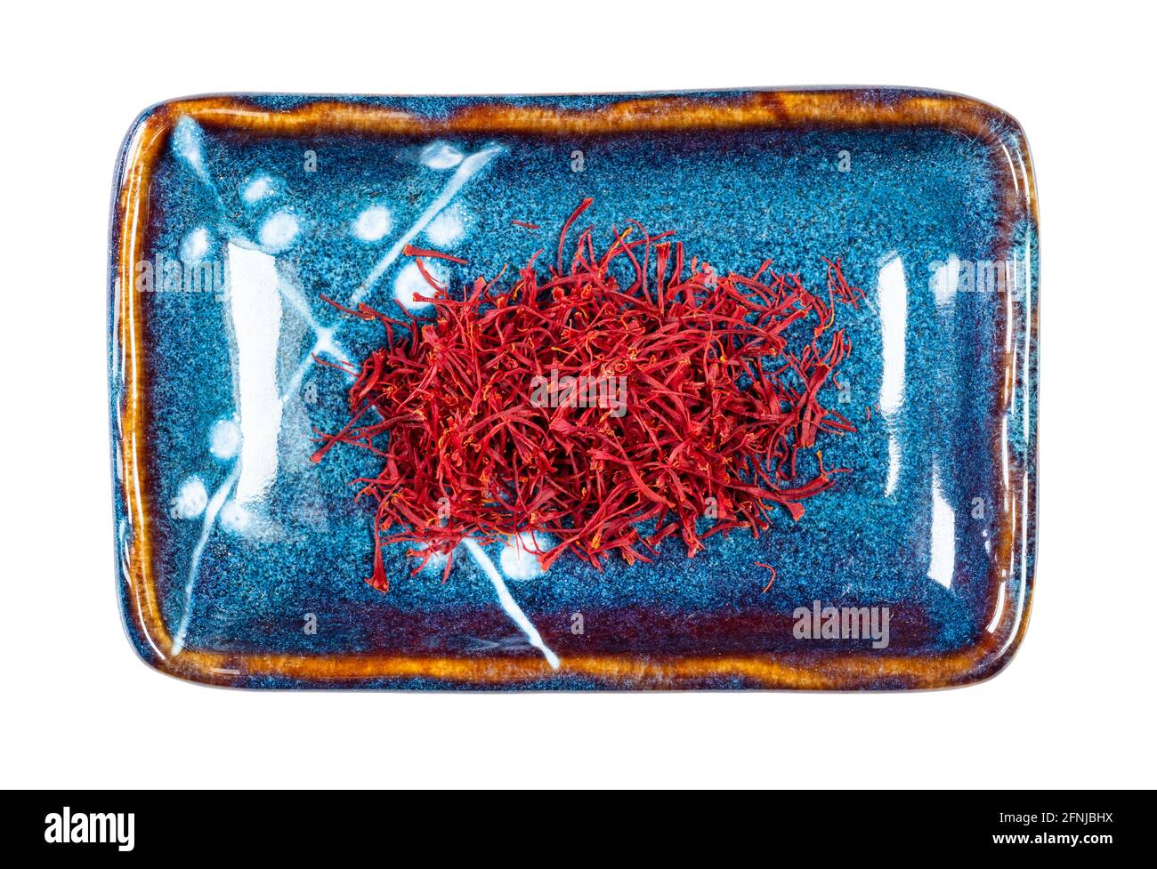 top view of natural saffron threads on rectangular plate cutout on ...