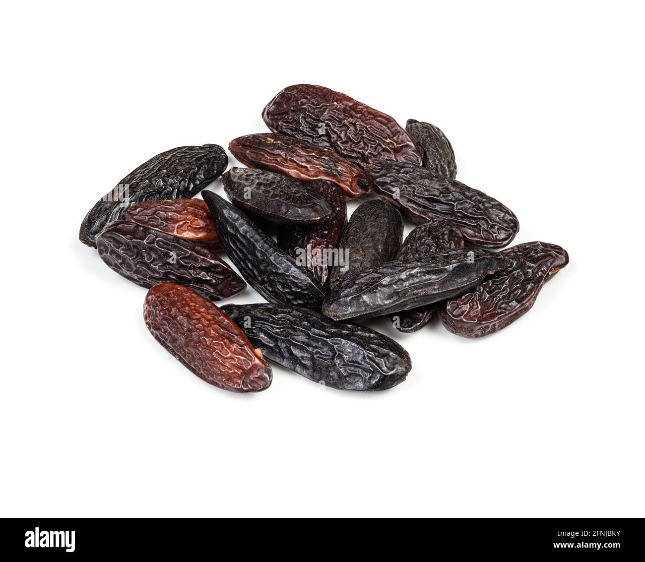 handful of dried tonka beans closeup on white background Stock Photo ...
