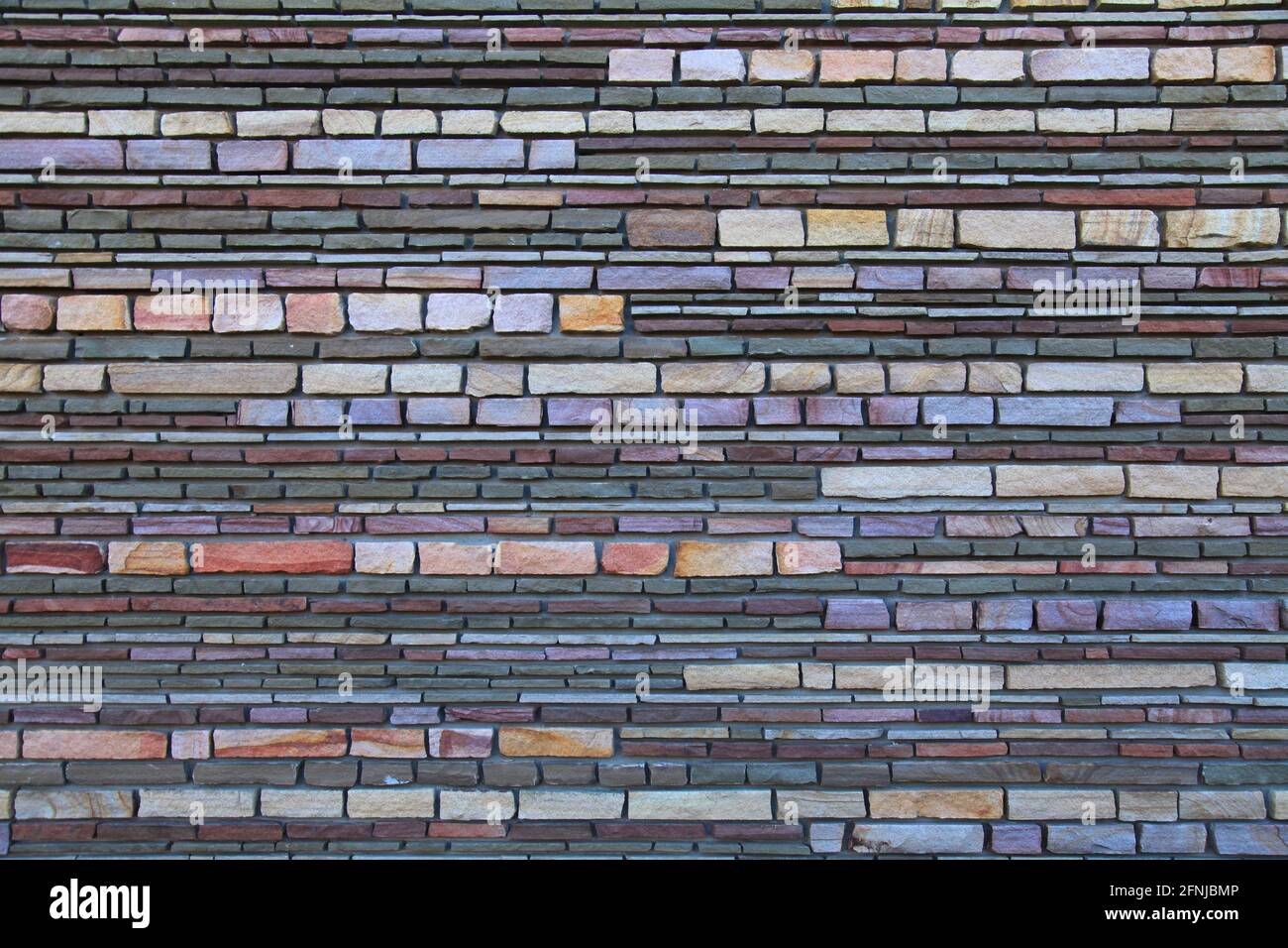 Surface and texture of multy-colored (colorful) decorative stone wall ...