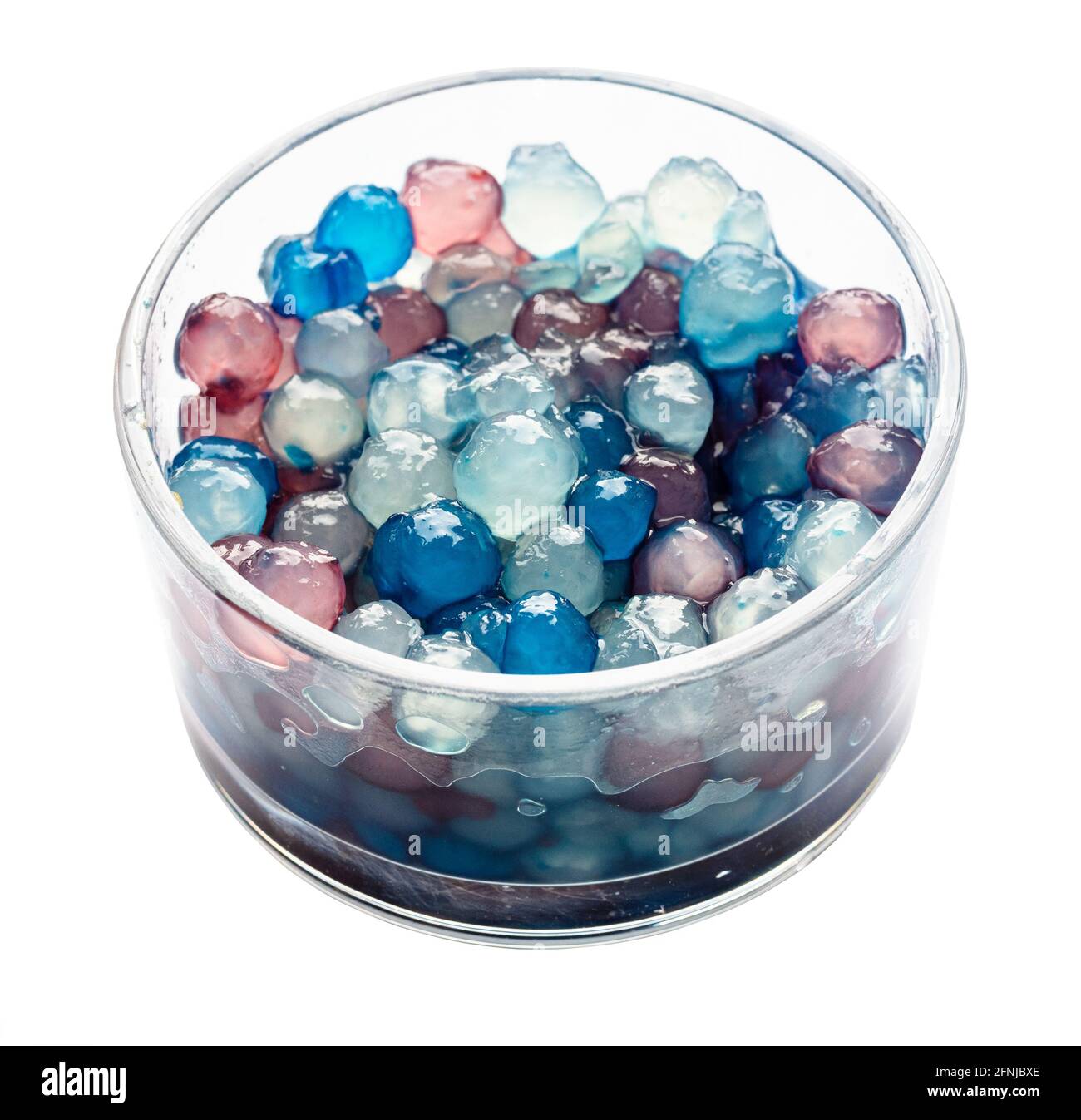 colorful boiled tapioca bubbles in glass bowl cutout on white ...
