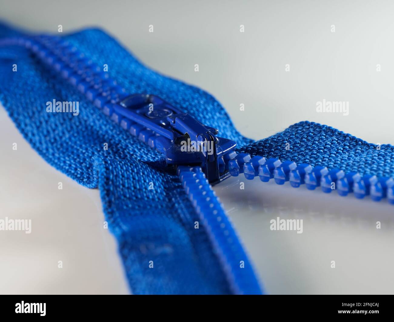 Closeup shot of a blue cloth zipper Stock Photo - Alamy