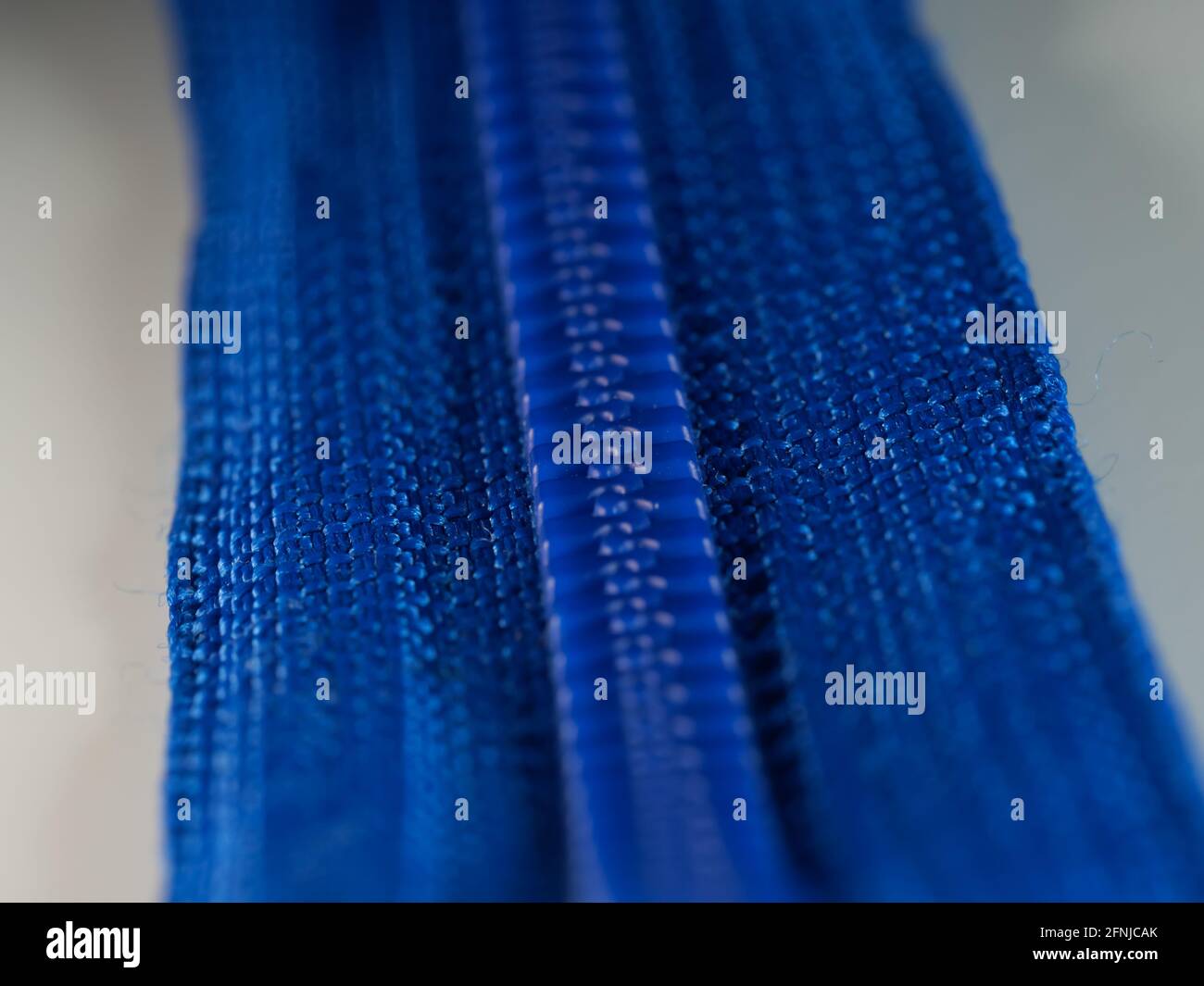 Closeup shot of a blue cloth zipper Stock Photo - Alamy