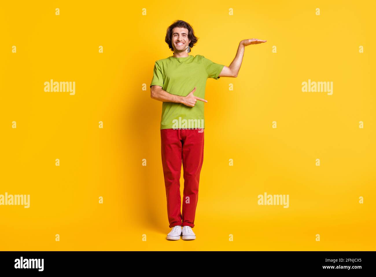 Full length body size photo of man demonstrating height pointing down ...