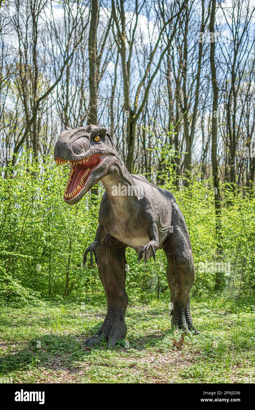 Dinosaur in the jungle Stock Photo - Alamy