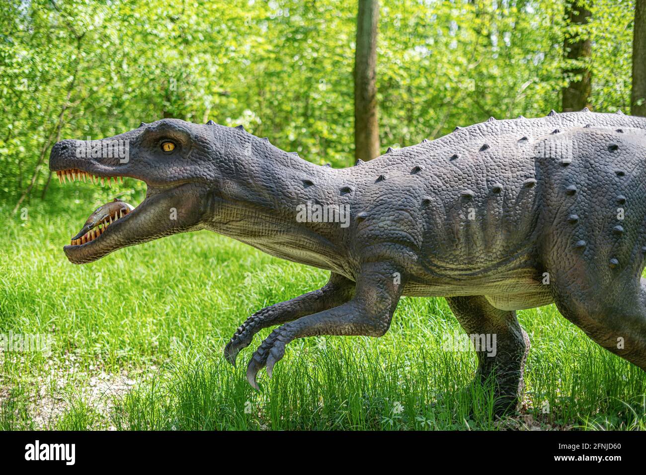 Dinosaur in the jungle Stock Photo - Alamy