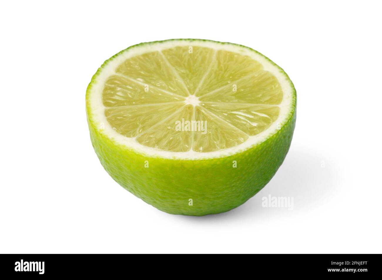 Lime half close up isolated on white background Stock Photo - Alamy