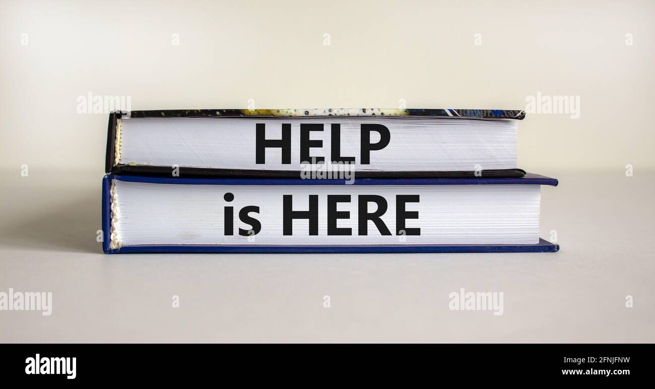 Help is here symbol. Books with words 'Help is here' on beautiful white ...