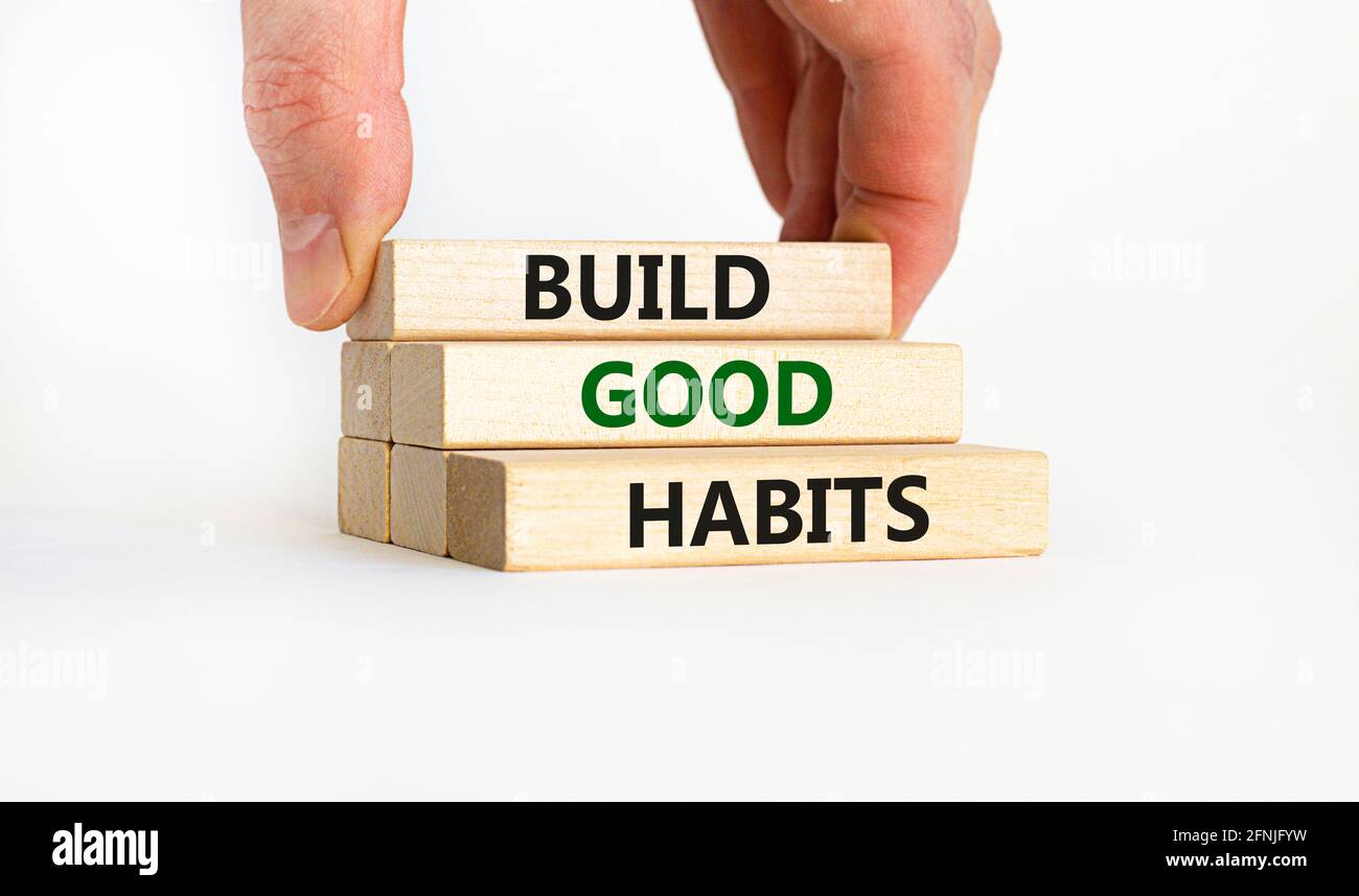 Build good habits symbol. Wooden blocks with words 'build good habits ...