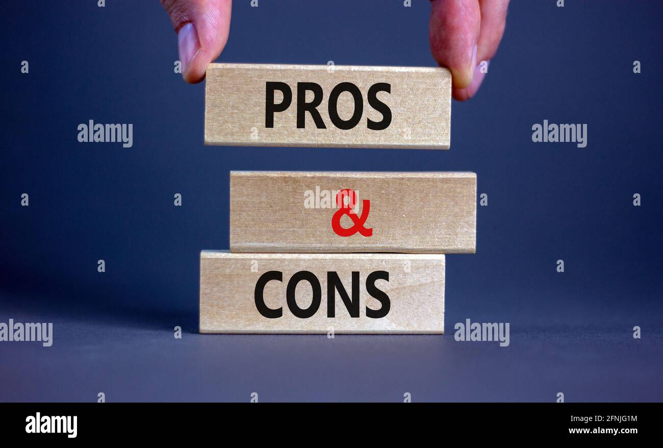 Pros and cons symbol. Wooden blocks with words 'Pros and cons ...
