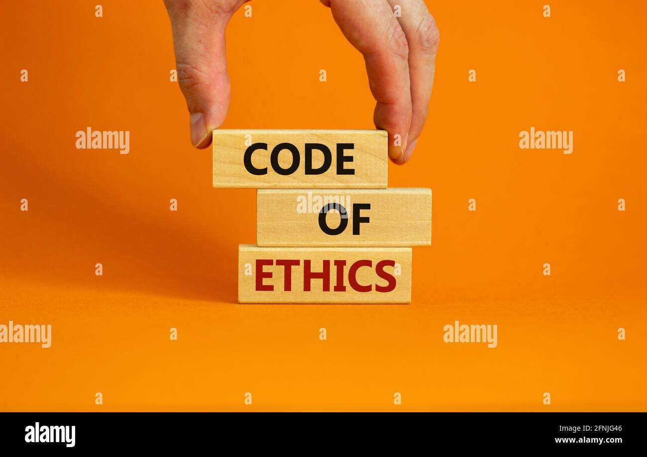 Code of ethics symbol. Concept words 'Code of ethics' on wooden blocks ...