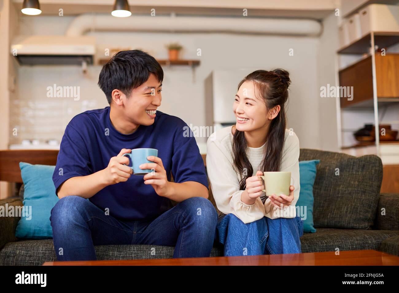 Young Japanese couple at home Stock Photo - Alamy