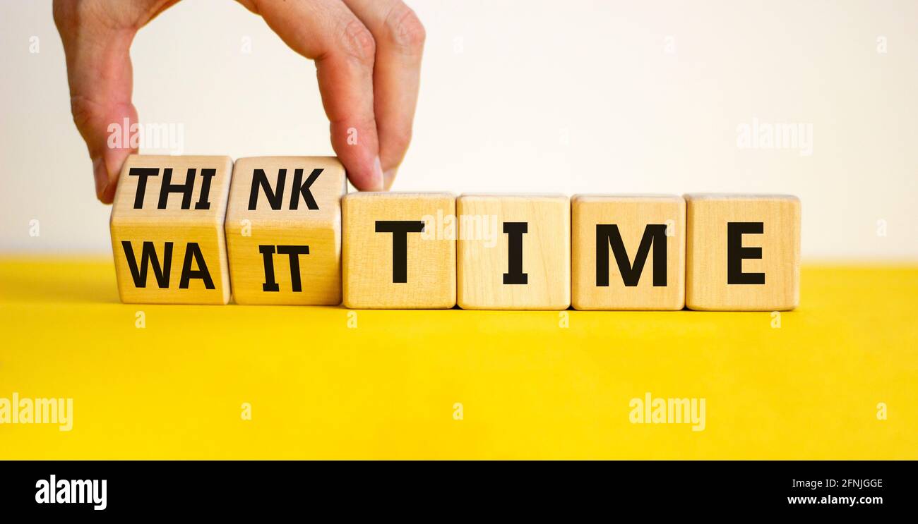 Think or wait time symbol. Businessman turns wooden cubes and changes ...