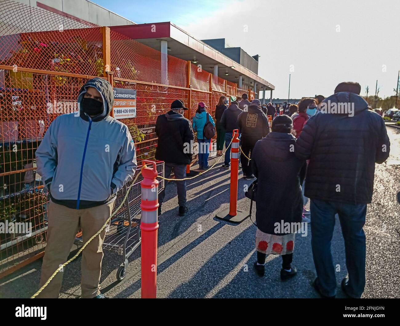 Toronto, Ontario, Canada, May 2021 - Customers line up in the early ...