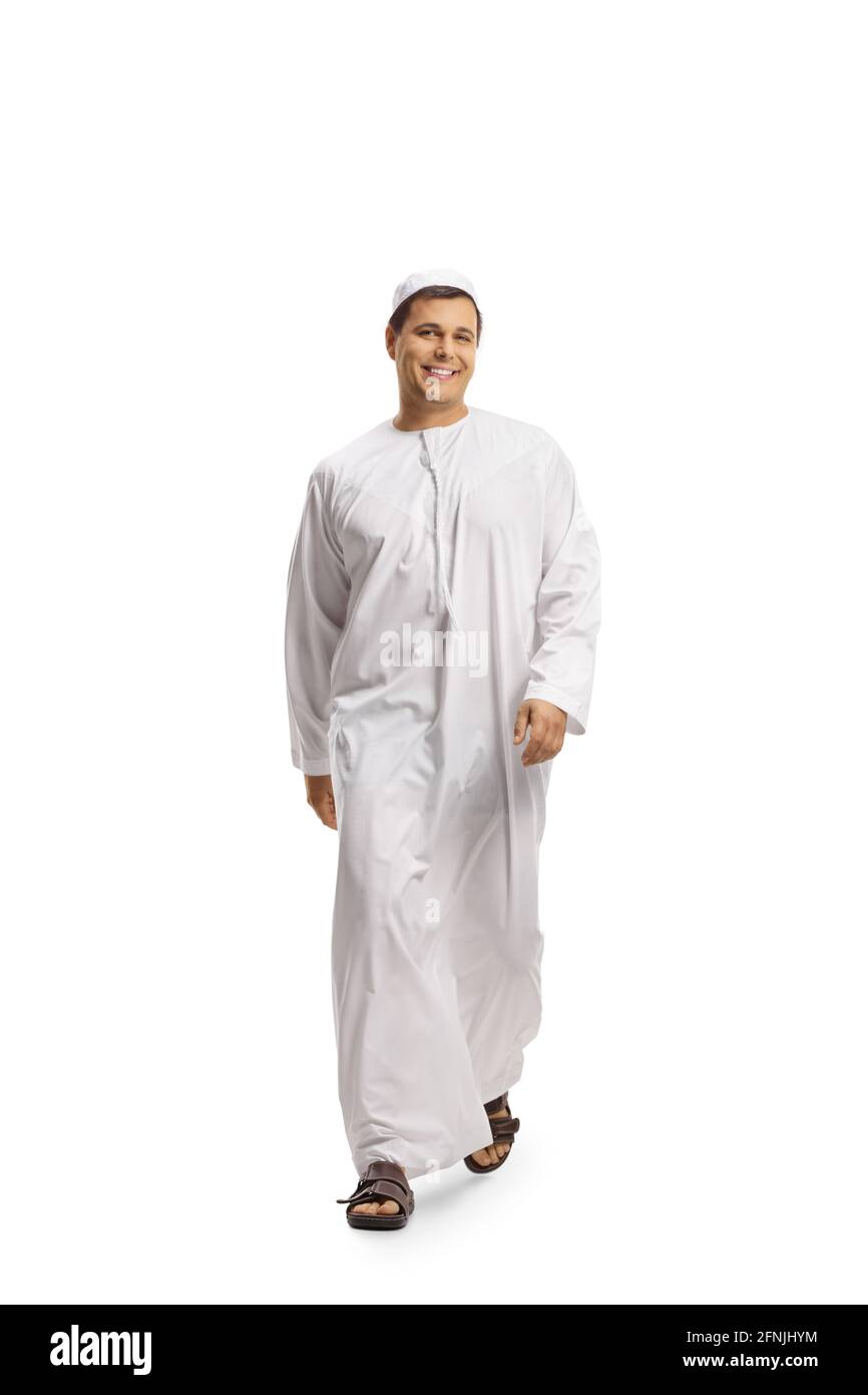 Full length portrait of a young muslim man in a traditional thobe ...