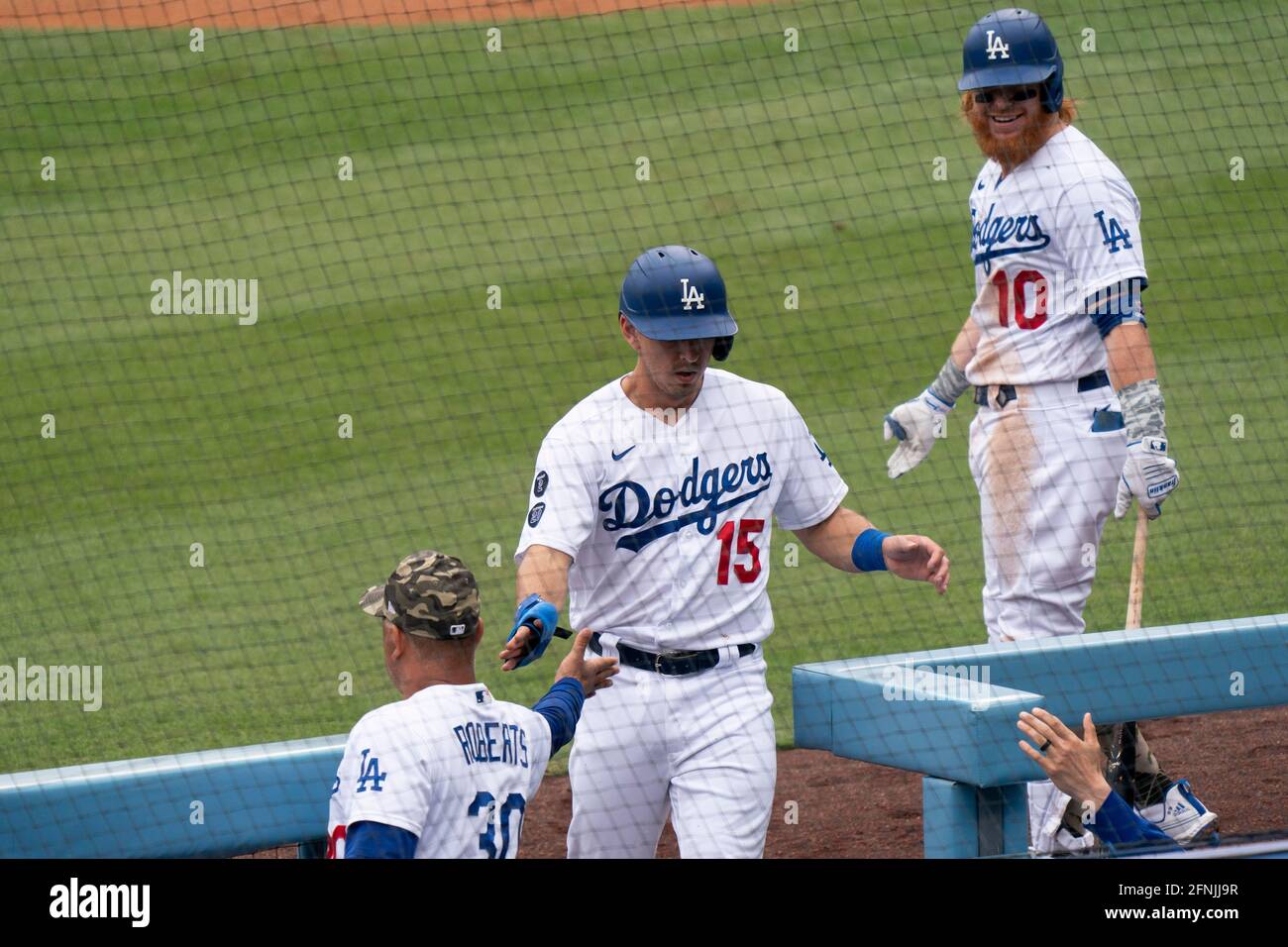 Los Angeles Dodgers catcher Austin Barnes (15) celebrates with manager ...