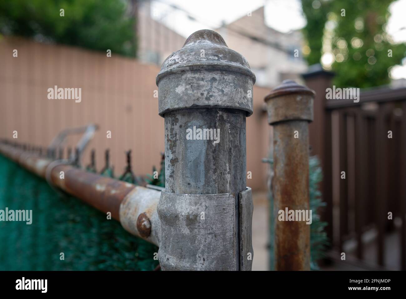 Weathered metallic column of an outdoor fence Stock Photo - Alamy