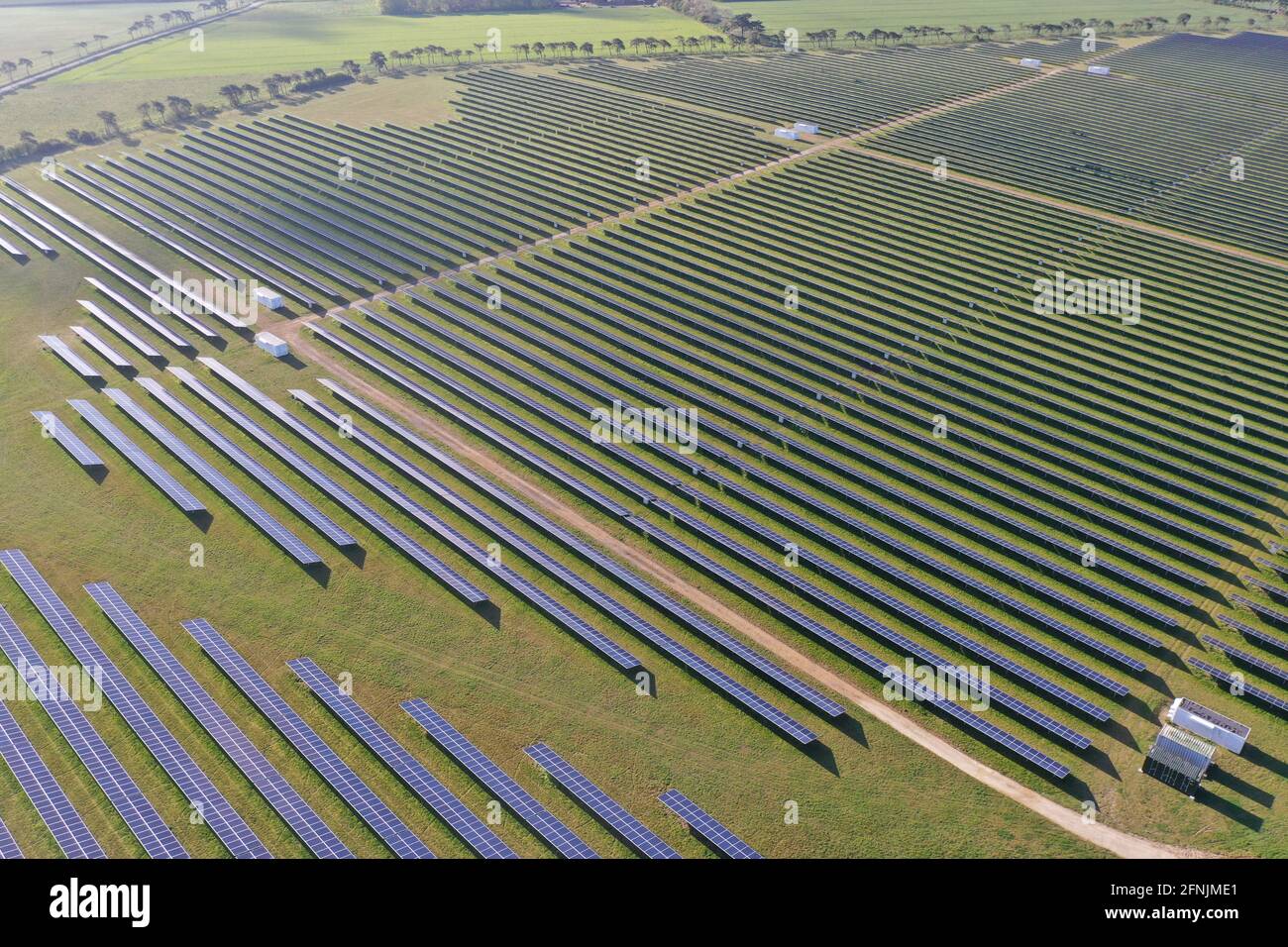 Solar panels in a field Stock Photo - Alamy