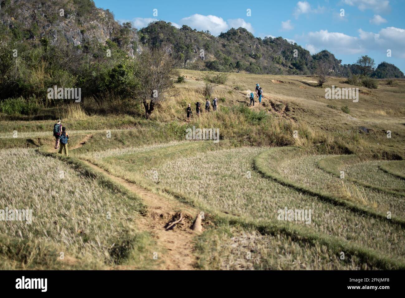 Shan state, Myanmar - January 6 2020: A tourist group with backpacks ...