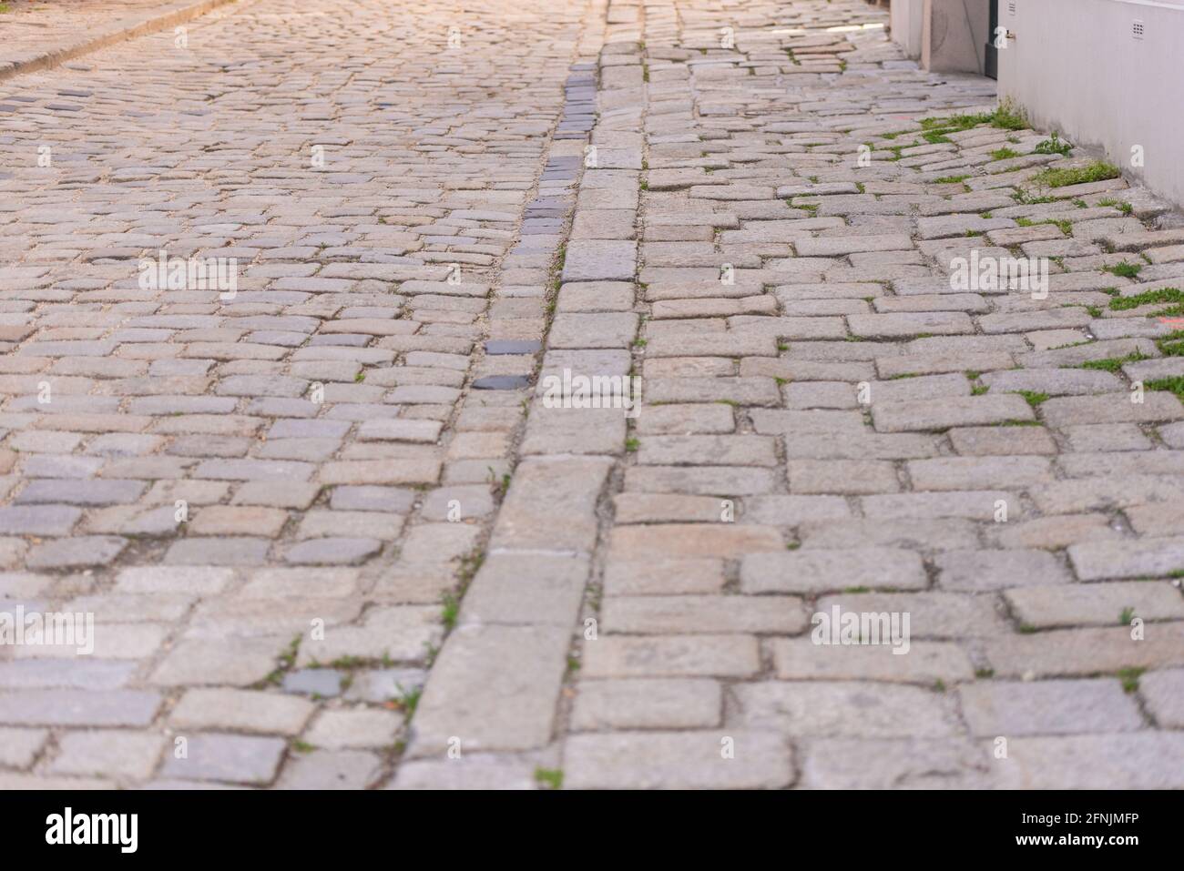Stone pavement on the street. Old pavement in the historical part of ...