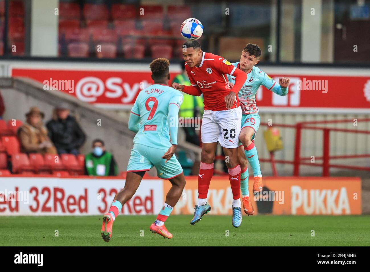 Toby Sibbick #20 of Barnsley wins the high-ball Stock Photo - Alamy