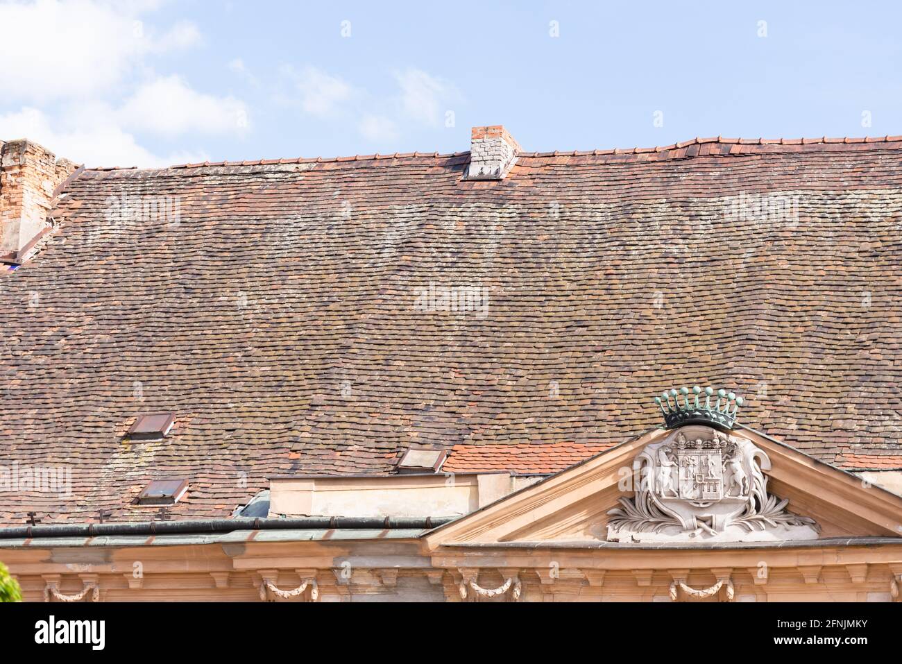 The roof is made of clay tiles. Old roof of a medieval building in ...