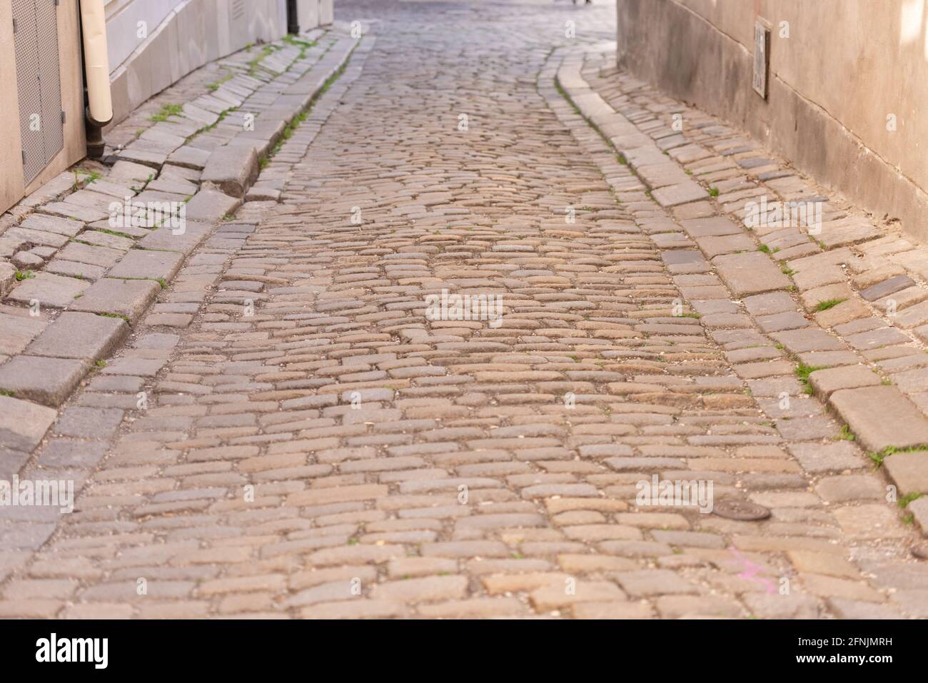 Stone pavement on the street. Old pavement in the historical part of ...