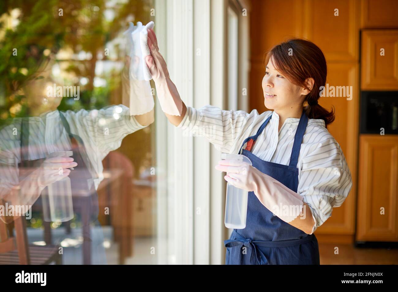 Japanese woman cleaning the house Stock Photo - Alamy