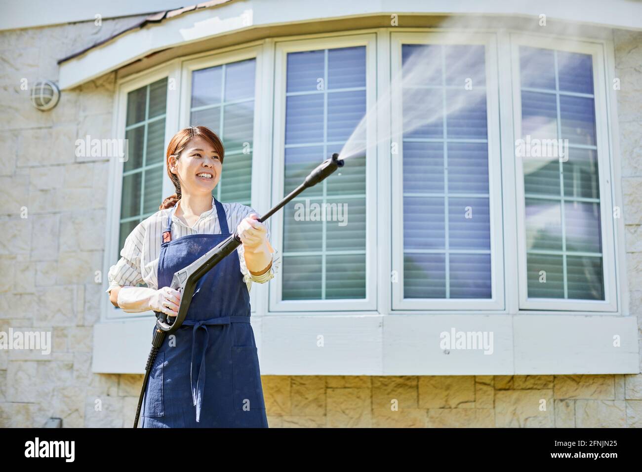 Japanese woman cleaning the house Stock Photo - Alamy