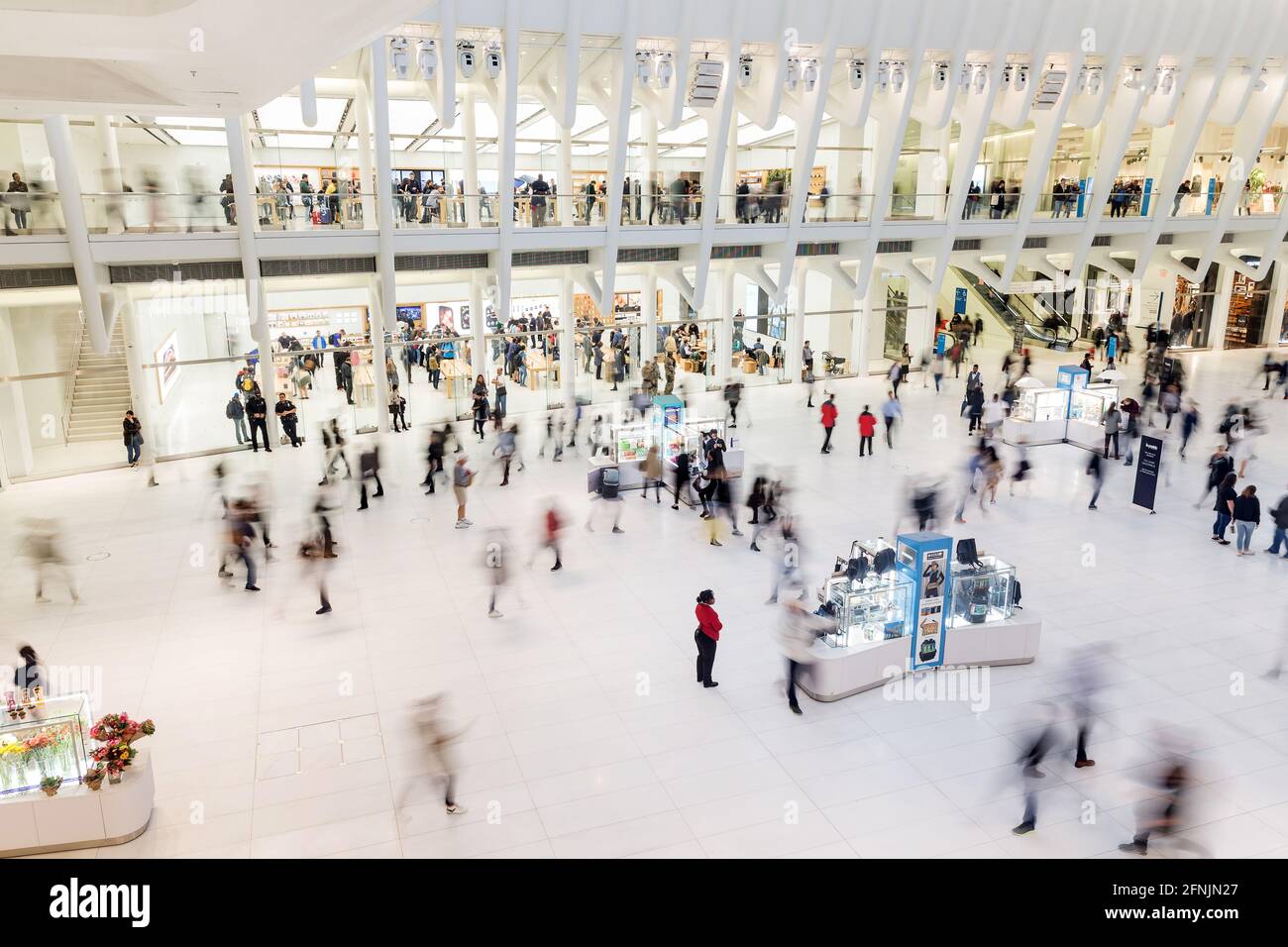 People moving across inside of the Oculus, New York's modern train ...
