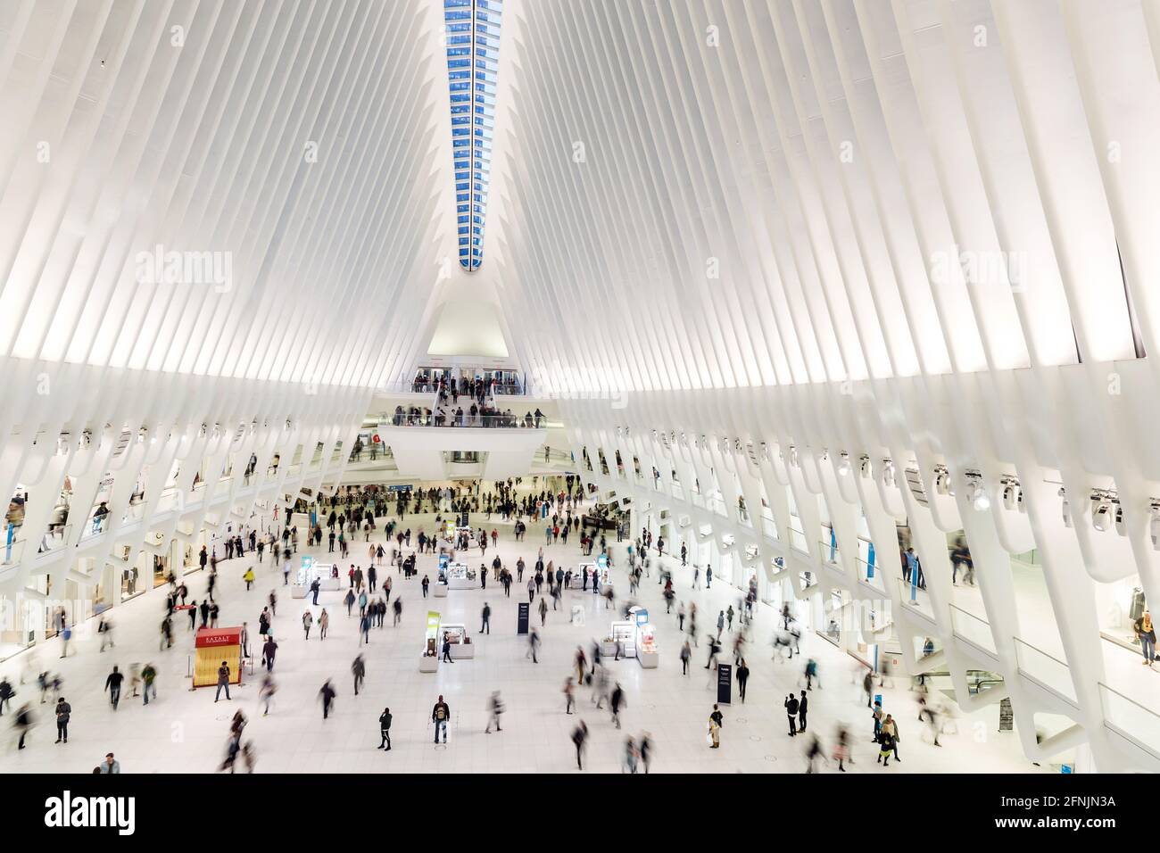 People moving across inside of the Oculus, New York's modern train ...