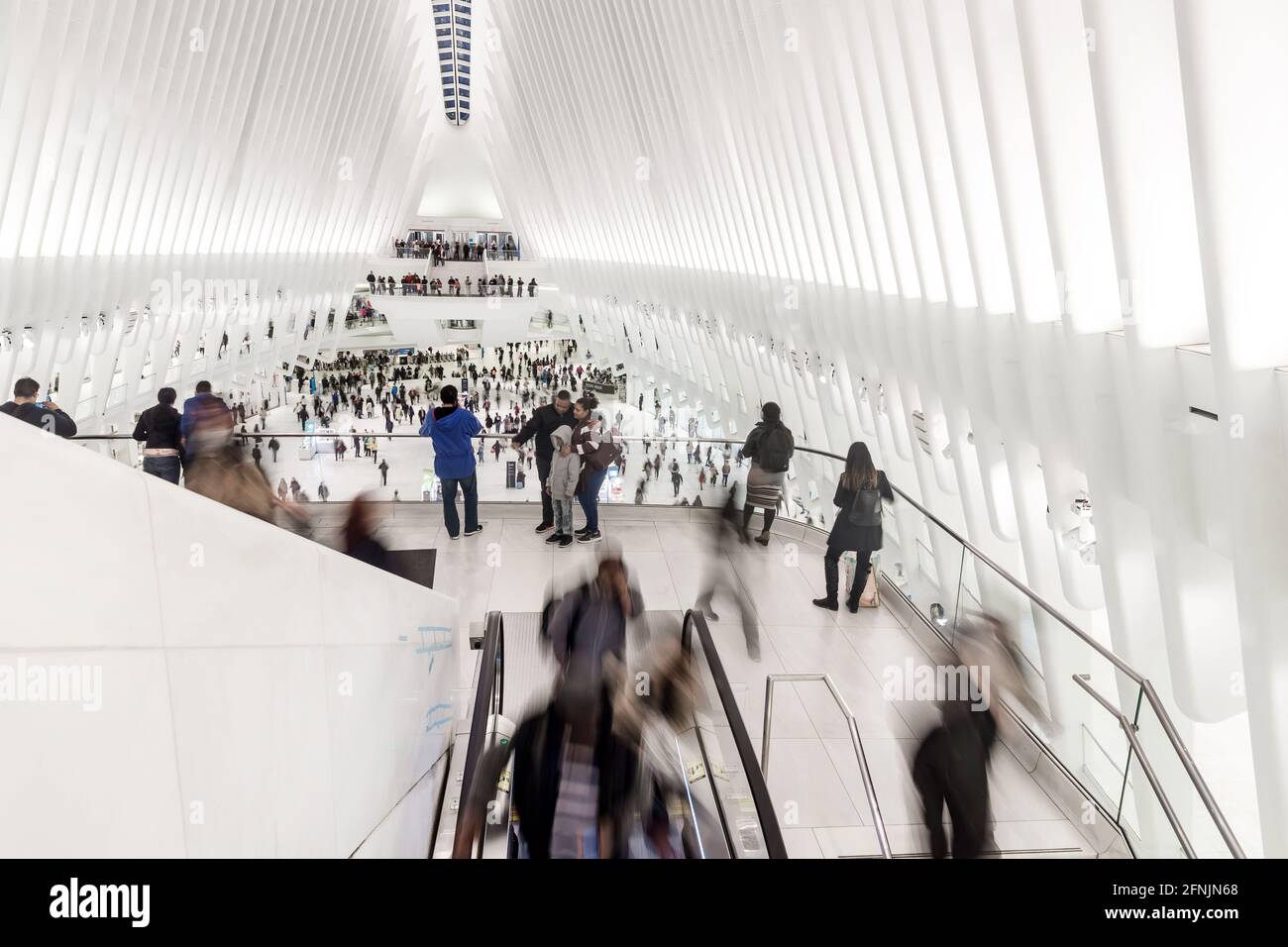 People moving across inside of the Oculus, New York's modern train ...