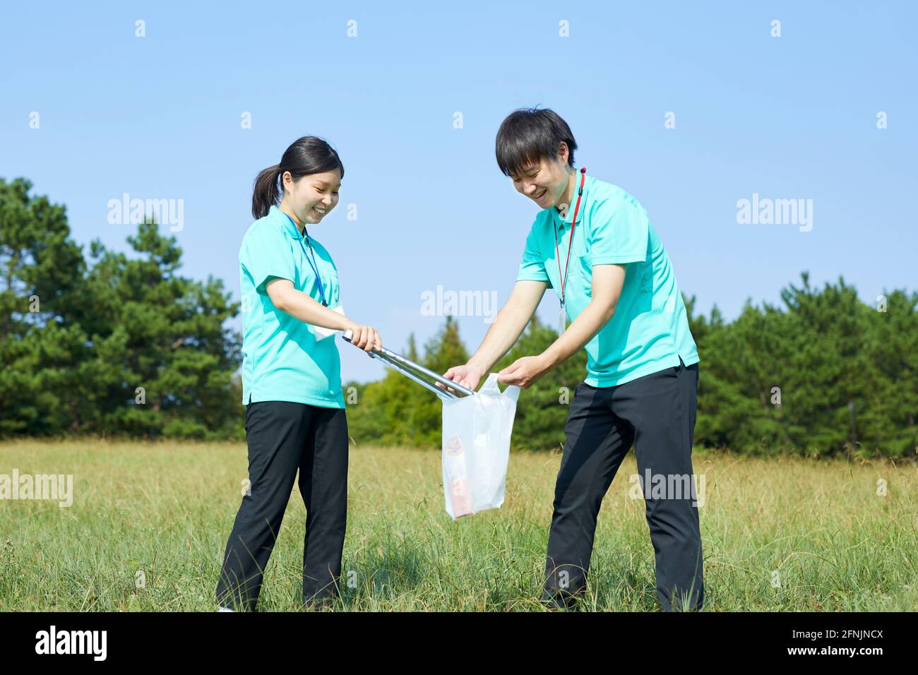 Collecting garbage at a city park Stock Photo - Alamy