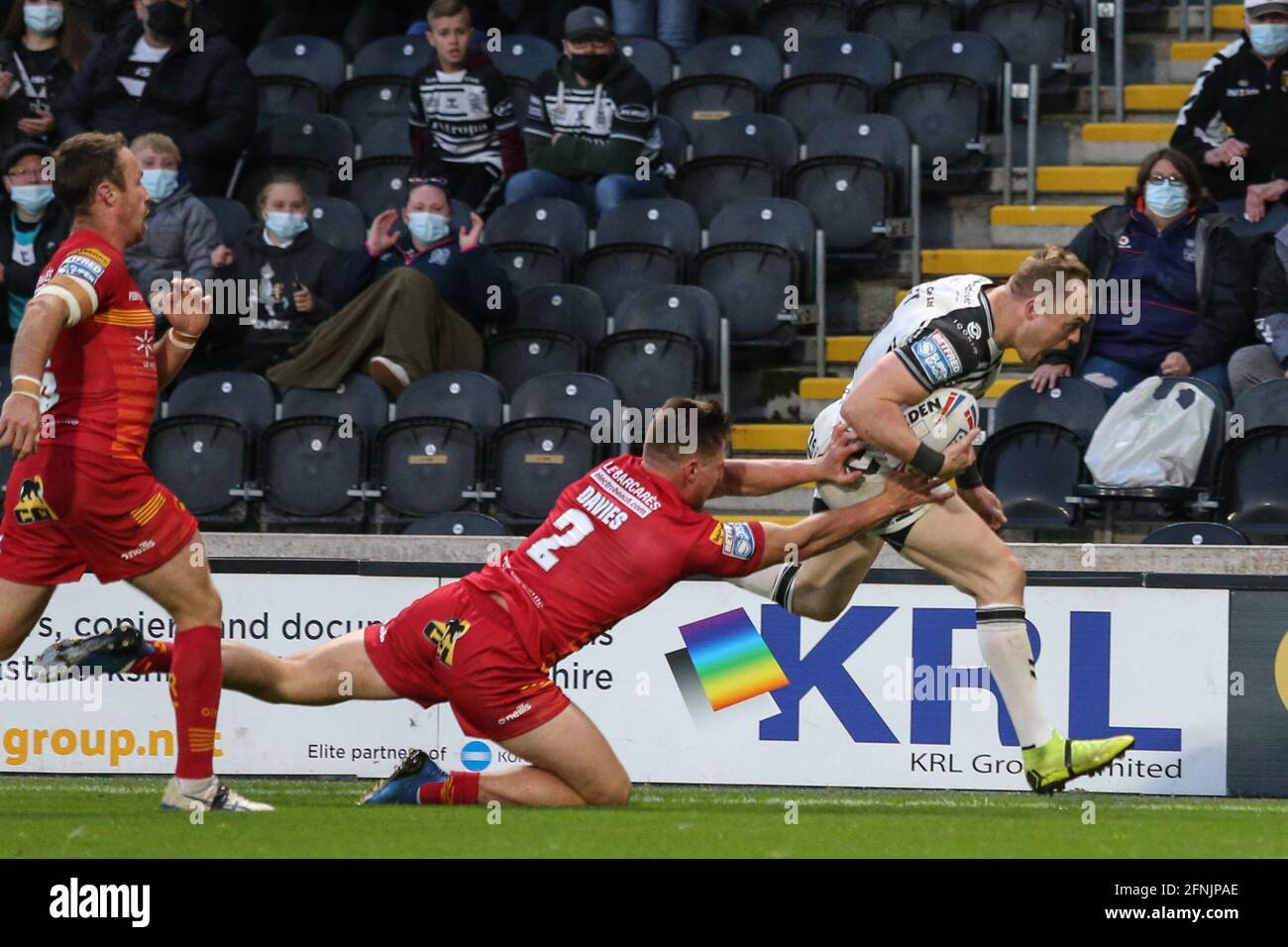 Adam Swift (21) of Hull FC goes past Tom Davies (2) of Catalans Dragons ...