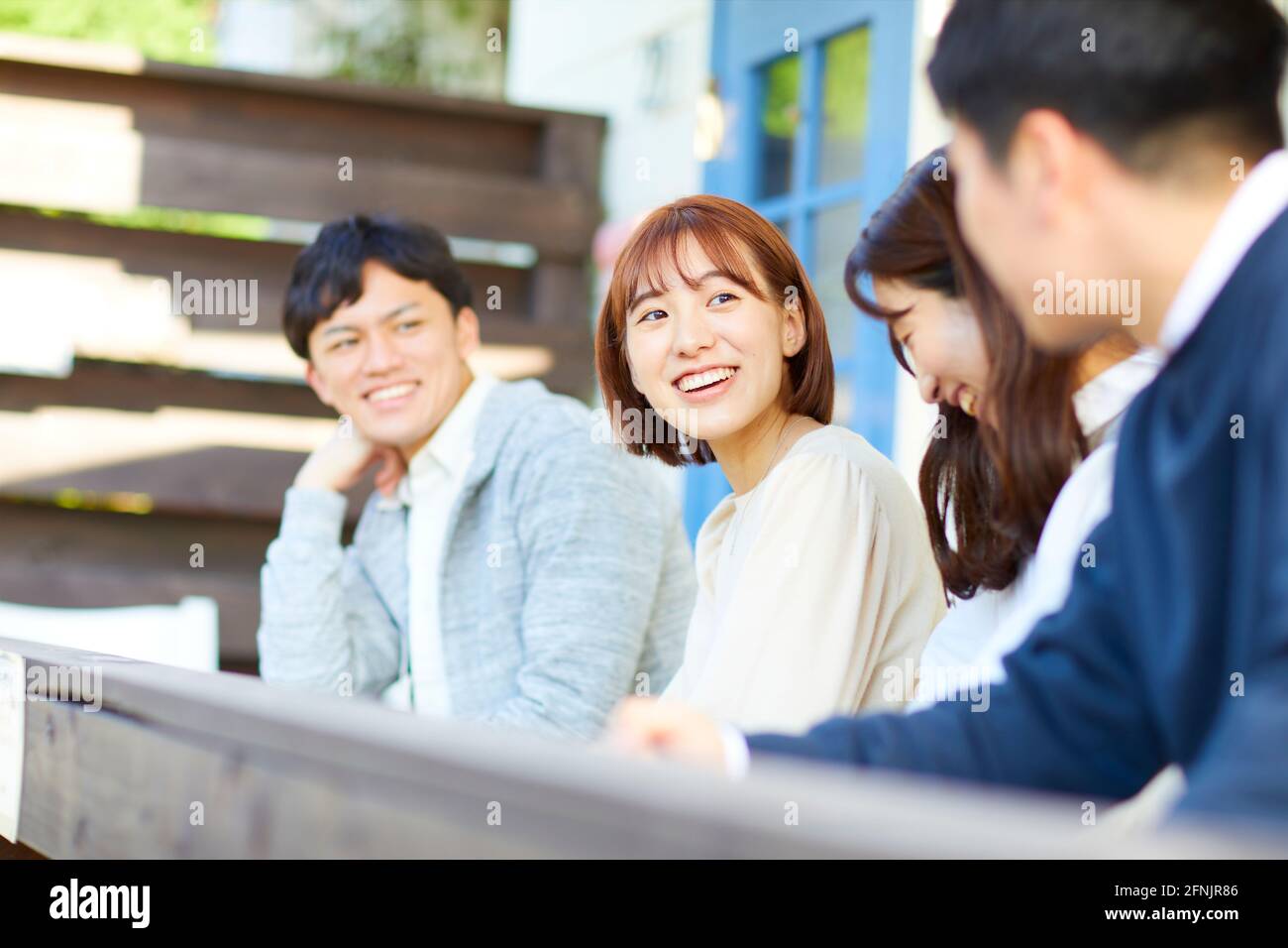 Young Japanese friends at a cafe Stock Photo - Alamy