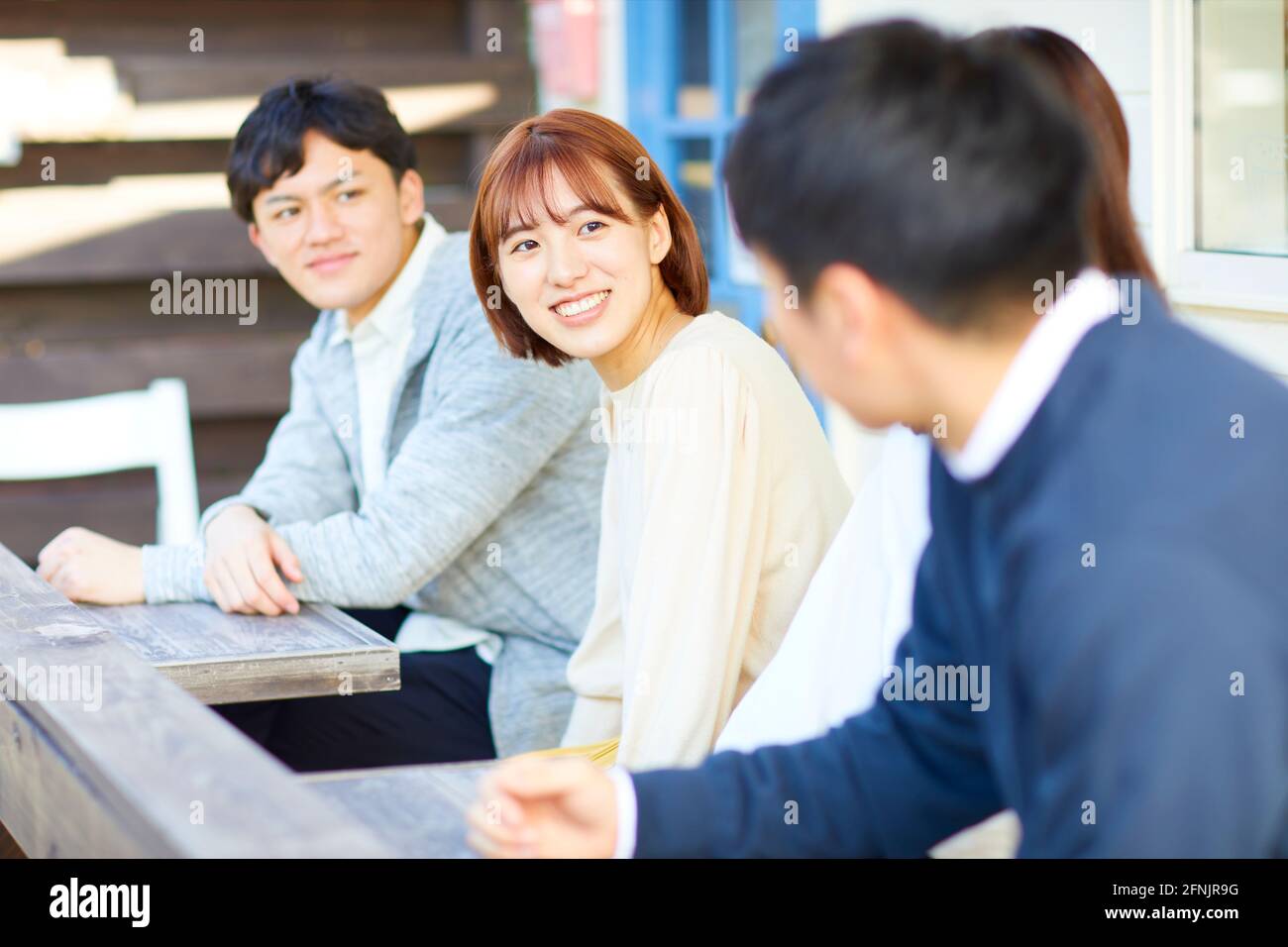 Young Japanese friends at a cafe Stock Photo - Alamy