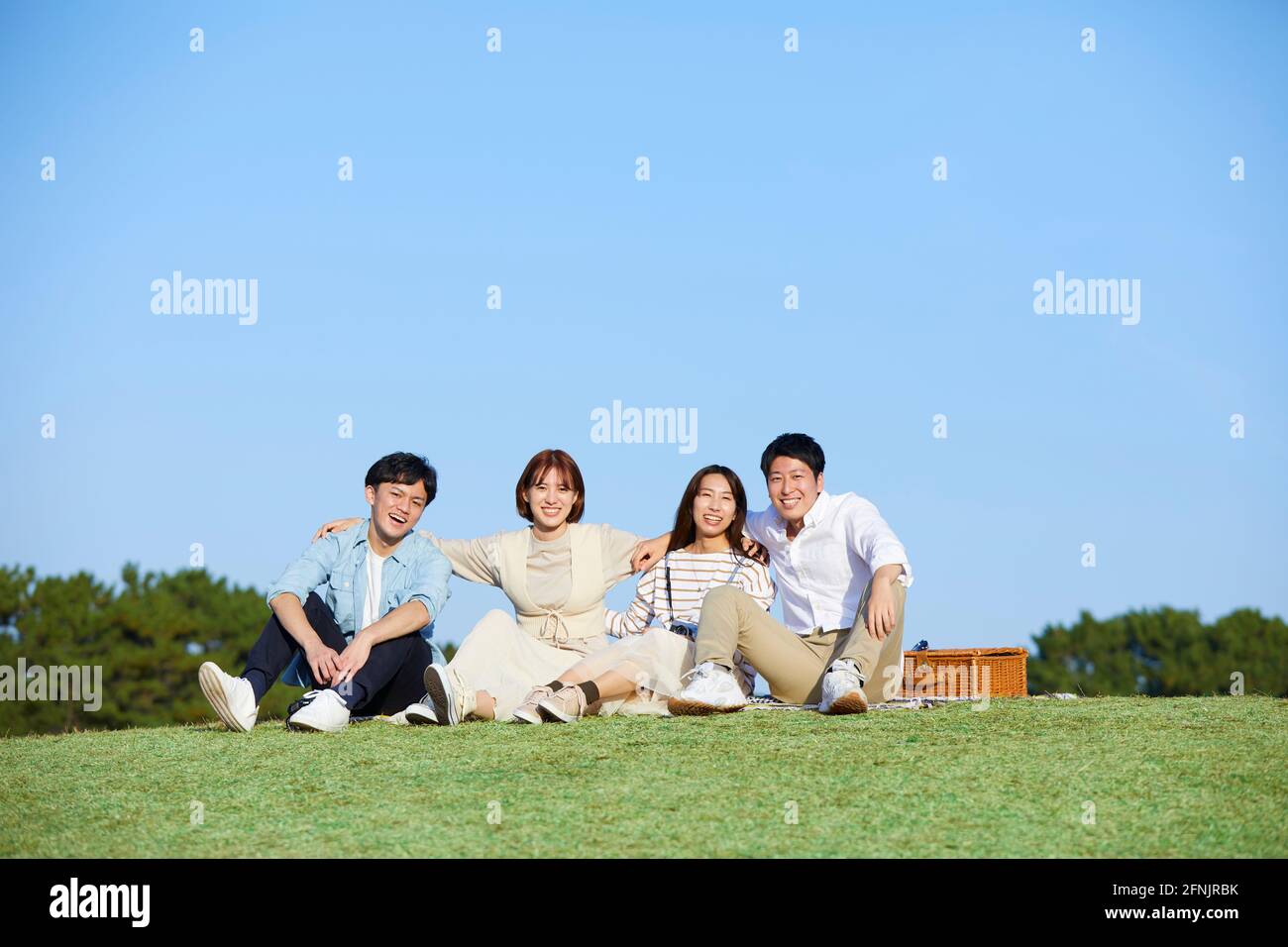 Young Japanese friends at a city park Stock Photo - Alamy