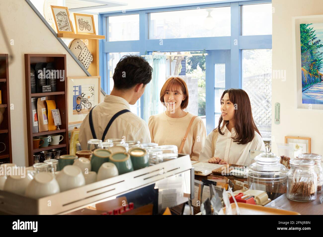 Young Japanese friends at a cafe Stock Photo - Alamy